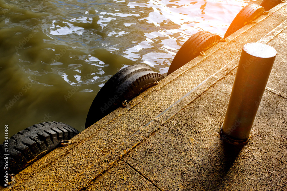 details of boat service pier with wavy water and sunlight effect for ...