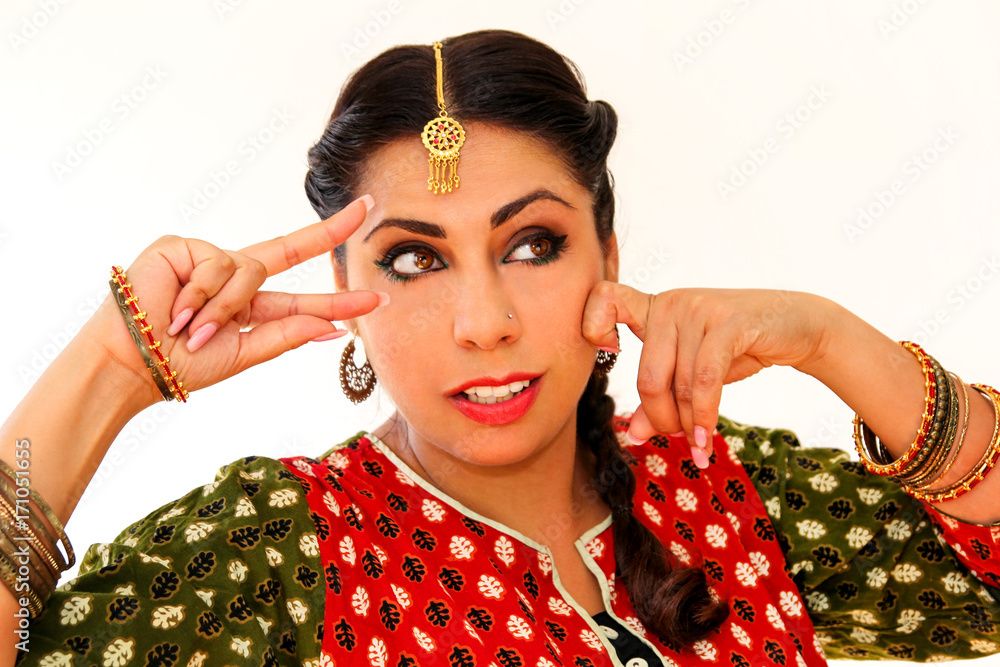 Woman dancing Indian dance in national dress. A beautiful girl portrait ...