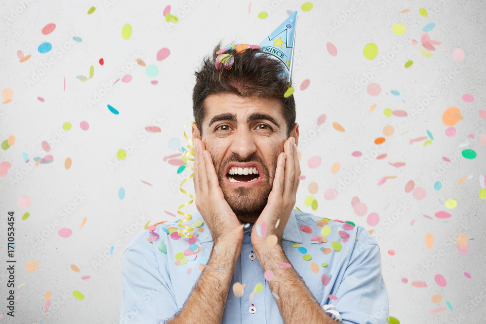 Picture of sociopathic young unshaven man in shirt screaming feeling ...