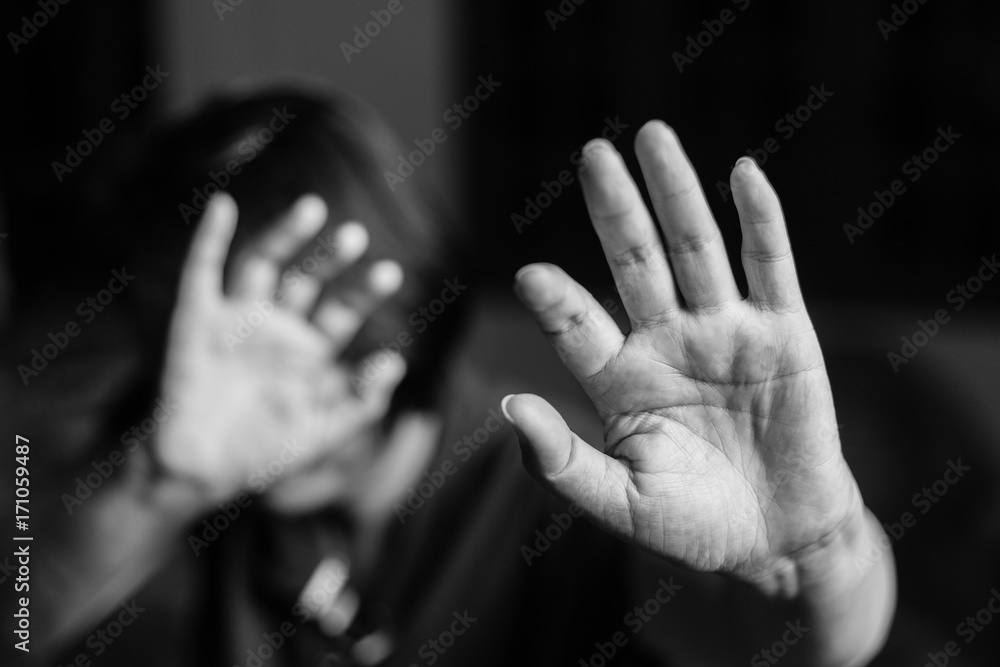 Woman with her hand extended signaling to stop (only her hand is in ...