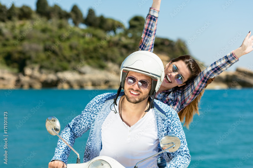 Beautiful young couple in love enjoying and having fun riding on a ...