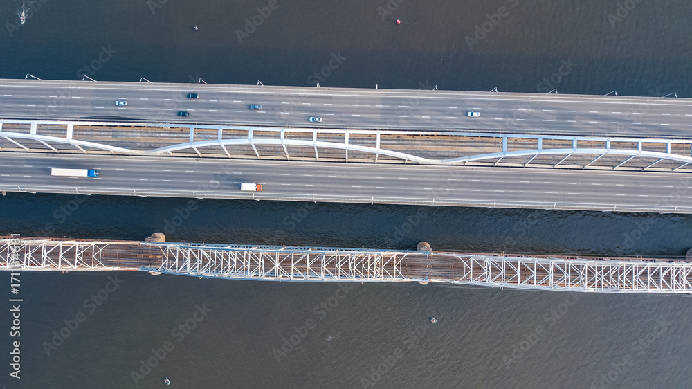 Aerial top view of bridge road automobile traffic of cars and railroad ...