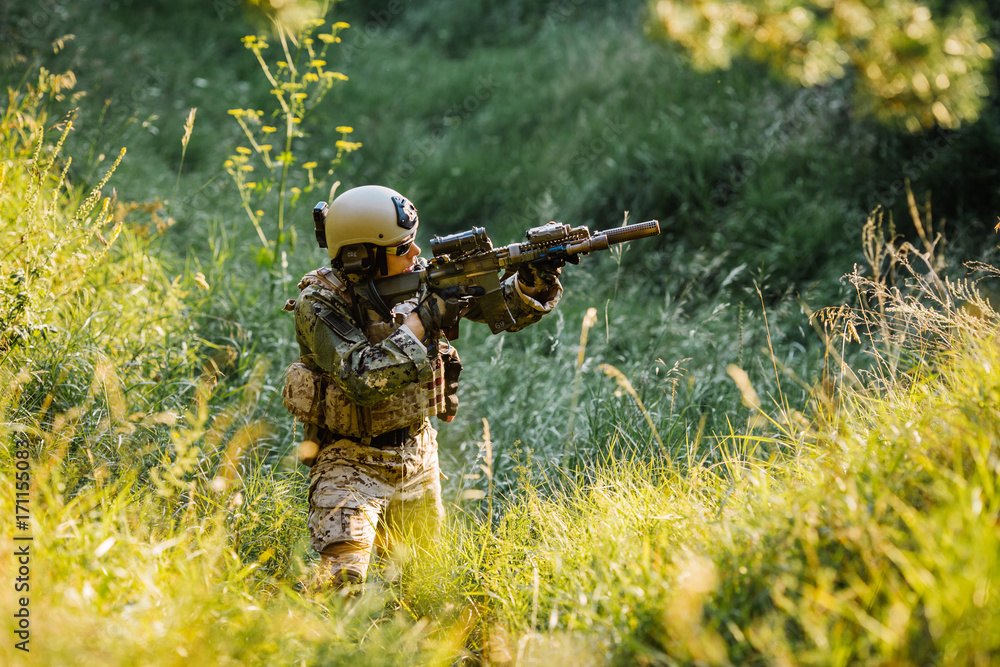 soldier of special forces in action pointing target and giving attack ...