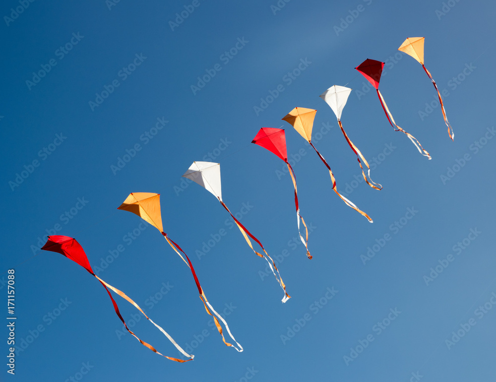 Colorful kites in a row Stock Photo | Adobe Stock