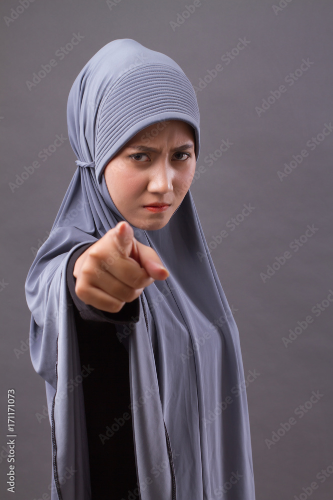 unhappy angry frustrated upset muslim woman pointing at you, with hijab ...