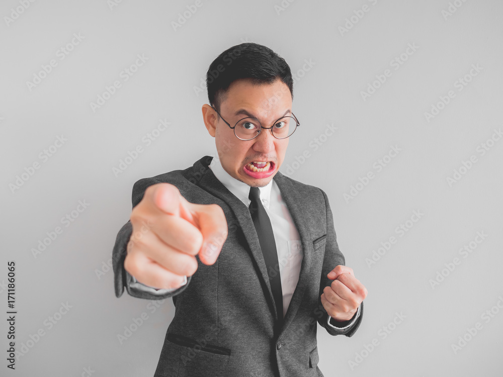 Angry boss manager businessman in black suite. Stock Photo | Adobe Stock