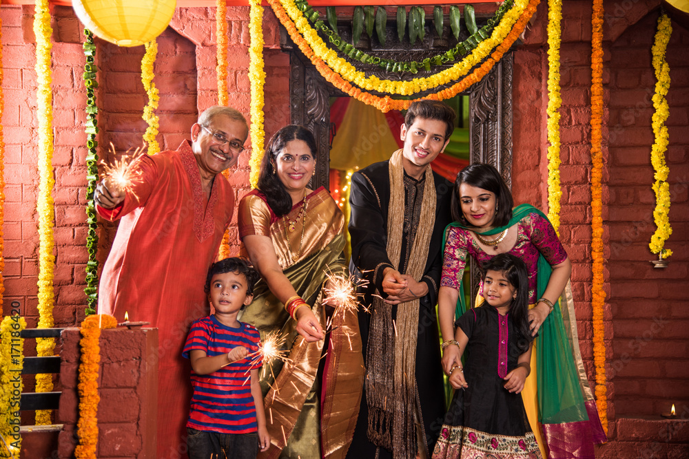 stock photo of Indian Family celebrating Diwali festival with fire ...