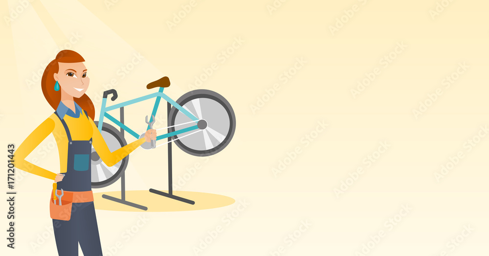 Caucasian bicycle mechanic showing spanner on the background of broken ...