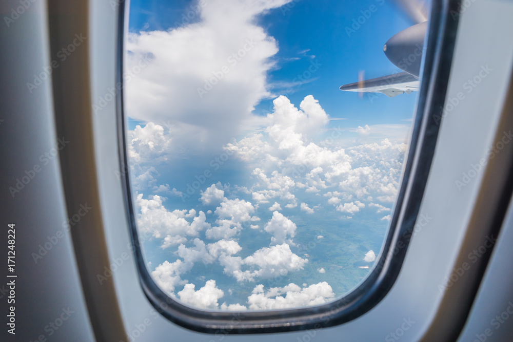 Cloud and sky as seen through window of an airplane. Stock Photo ...