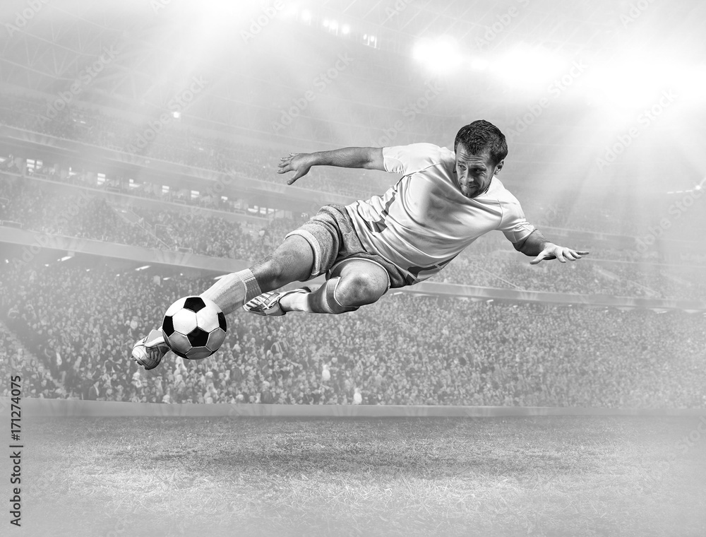 Soccer player with ball in action on field of stadium Stock Photo ...