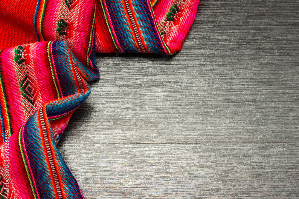 Color pattern tablecloth on wooden table for background. Fabric texture ...
