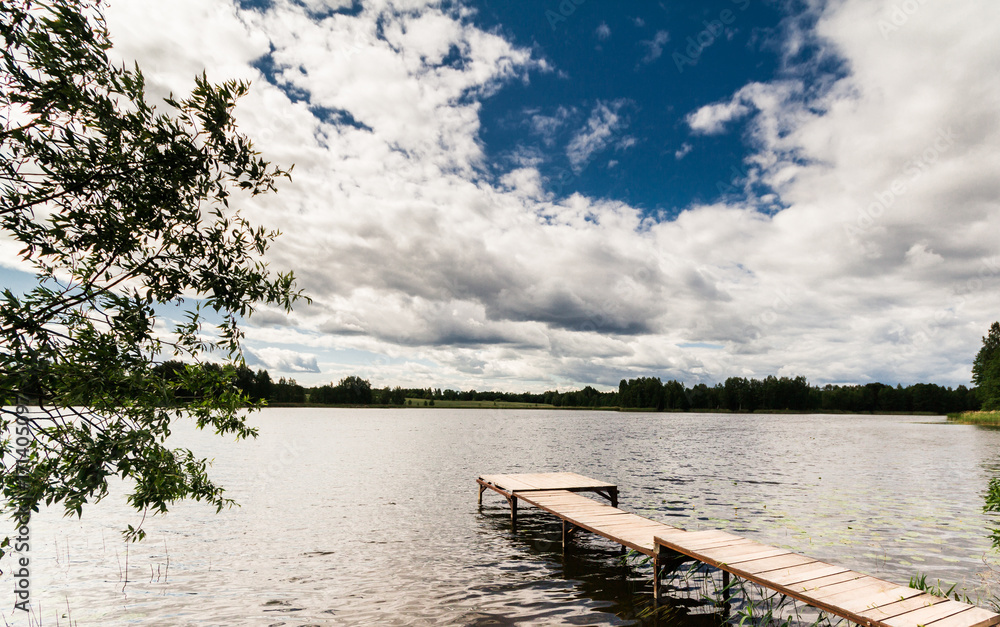 Wooden bridge on the river bank Stock Photo | Adobe Stock