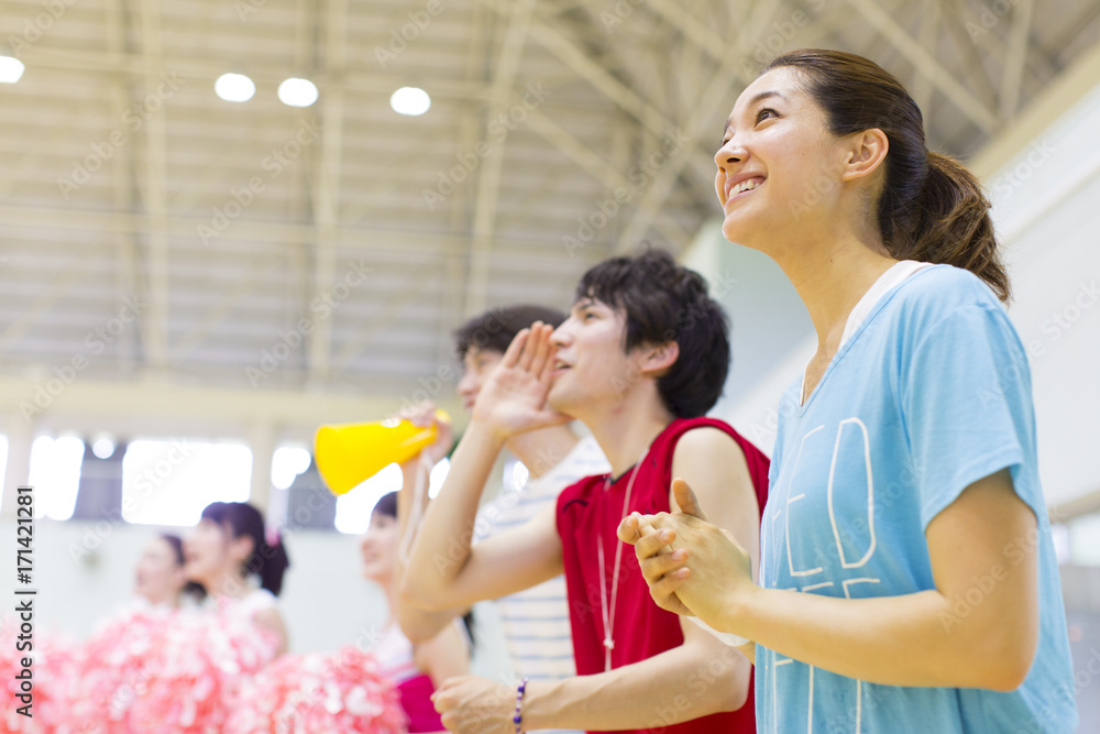 Students Cheering for the Team in Gymnasium Stock Photo | Adobe Stock