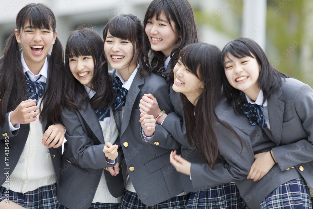 Portrait of high school girls laughing Stock Photo | Adobe Stock