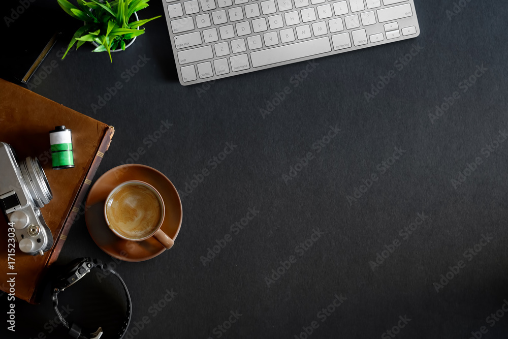 Work space concept : Office dark desk table with computer and supplies ...