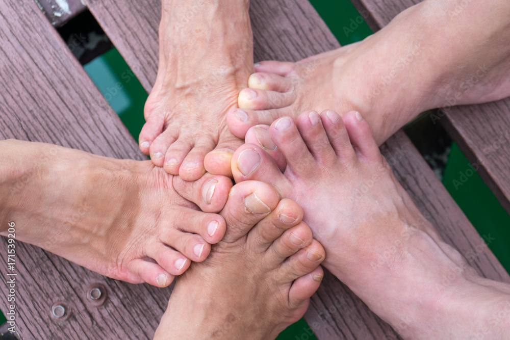 Top view of feet of people standing in a circle,feet together teamwork ...