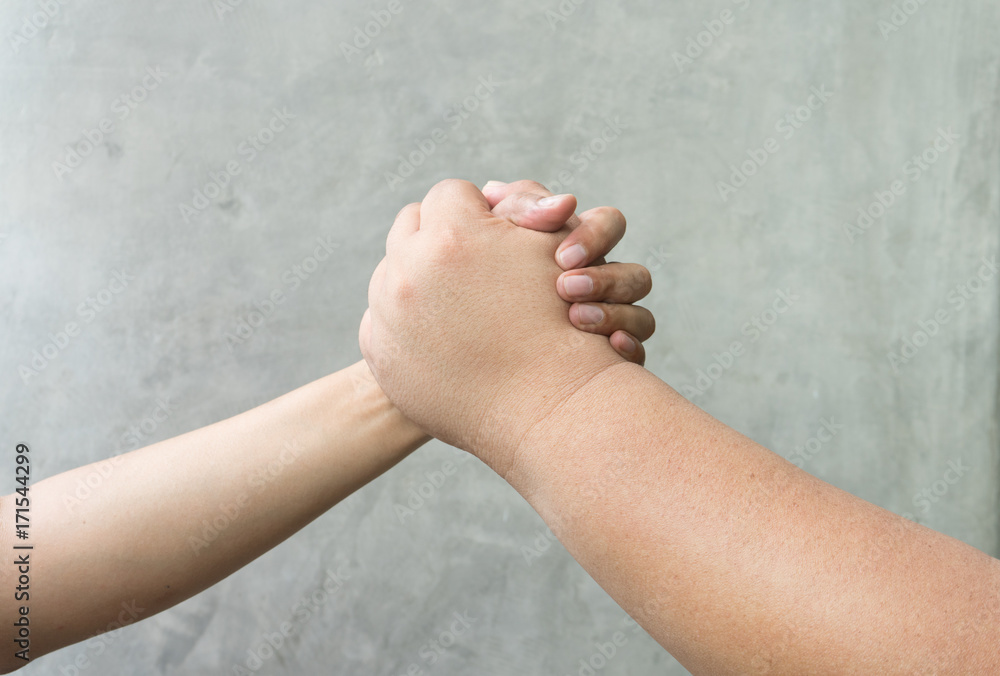 Closeup of two hands joining together by big and little hand ...