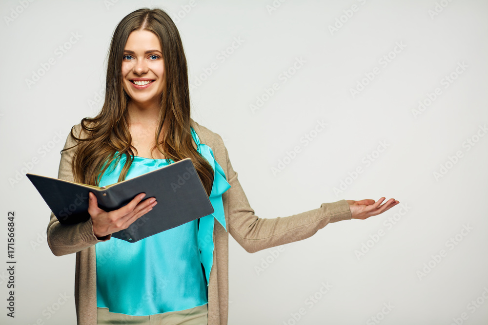 Smiling woman holding open book pointing with hand. foto de Stock ...
