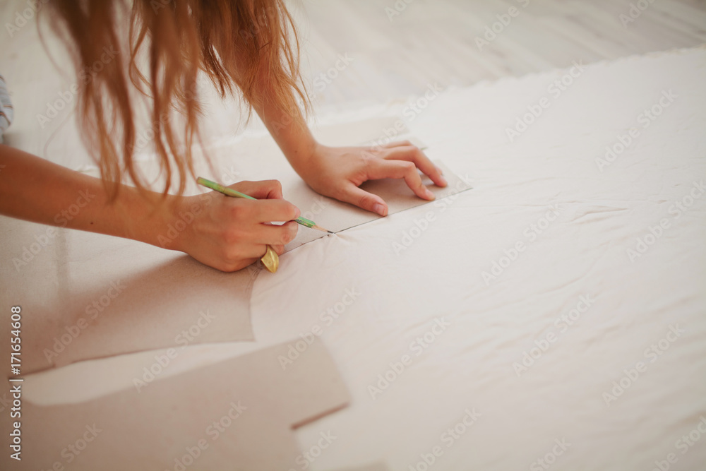 girl making a pattern sketch with a pencil and a template Stock Photo ...