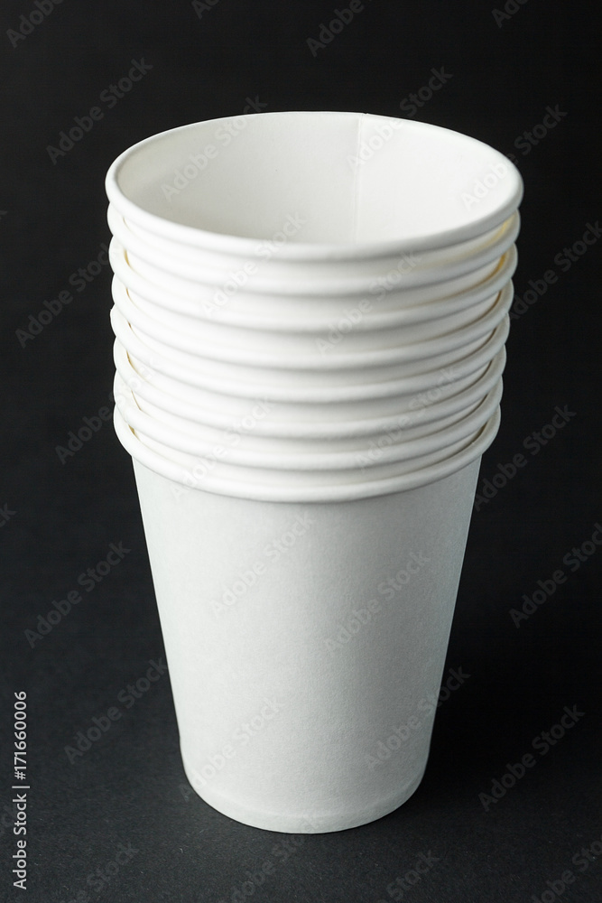 Packing a new white paper cup layout on a black background, space for ...
