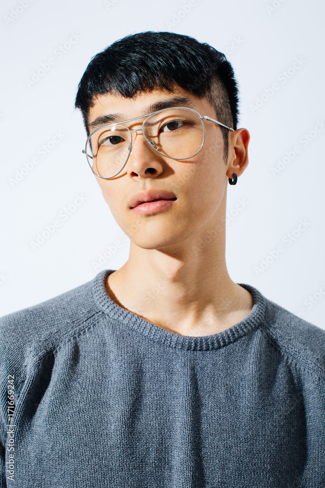 Portrait of an asian trendy man over white background. ภาพถ่ายสต็อก ...