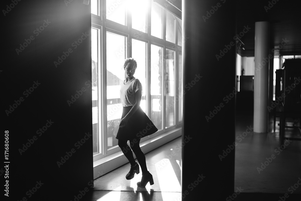 Girl dancing in front of a window Stock Photo | Adobe Stock