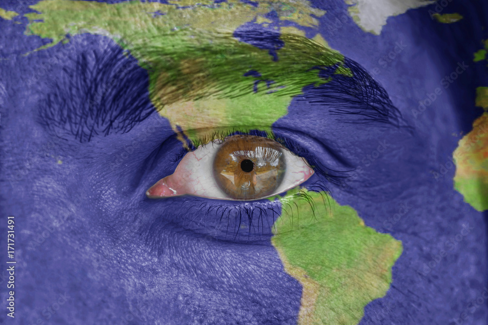 Human face and eye painted with South and North America space geography ...