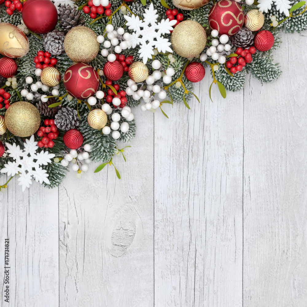 Christmas background with bauble decorations, holly, mistletoe, ivy ...