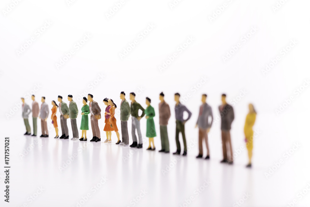 Miniature people standing in line over white background. Stock Photo ...
