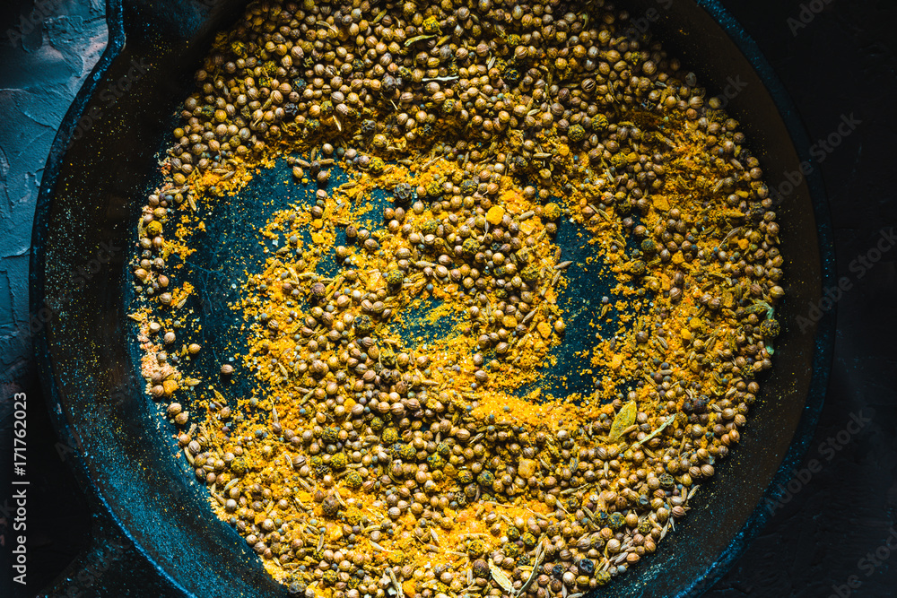 Cooking masala for curry in the pan on the dark background horizontal ...
