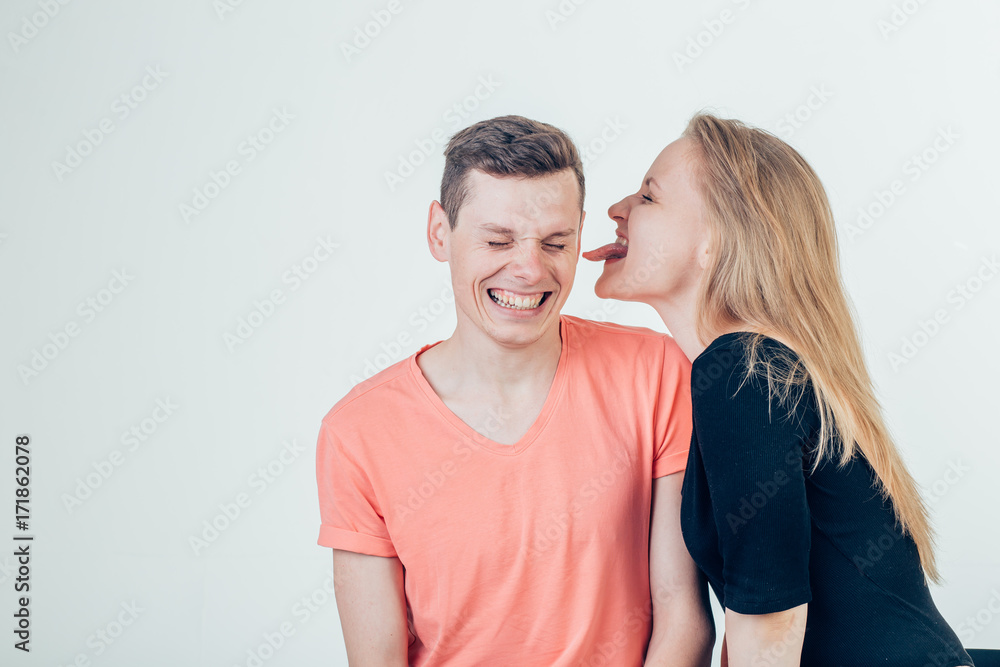 handsome man with beautiful sexy woman licking man cheek Stock Photo ...