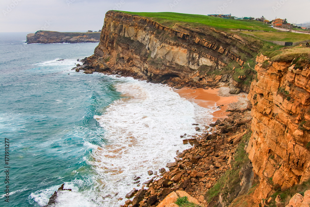 Cliffs of Suances at sunset , which stretches around the confluence of ...