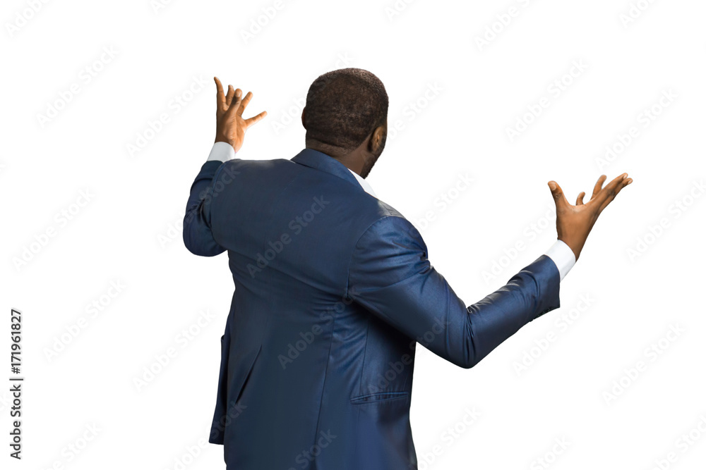 Back view of shocked and scared young businessman. Rear view of ...