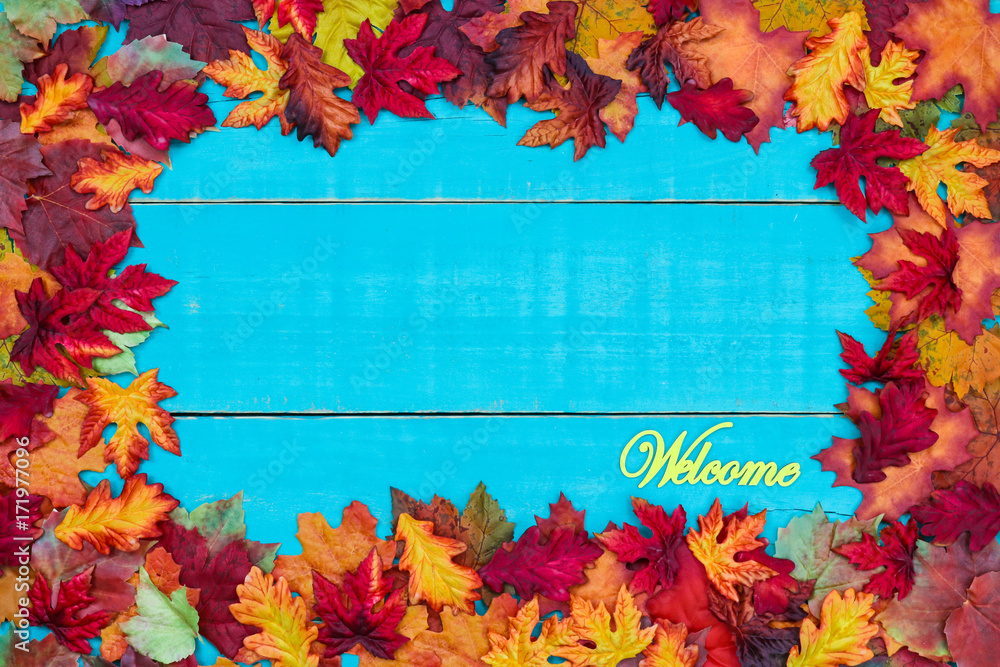 Welcome sign hanging on antique rustic teal blue wood background with ...