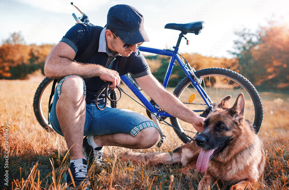Dog owner with his pet in the park. Pets and animals concept Stock ...