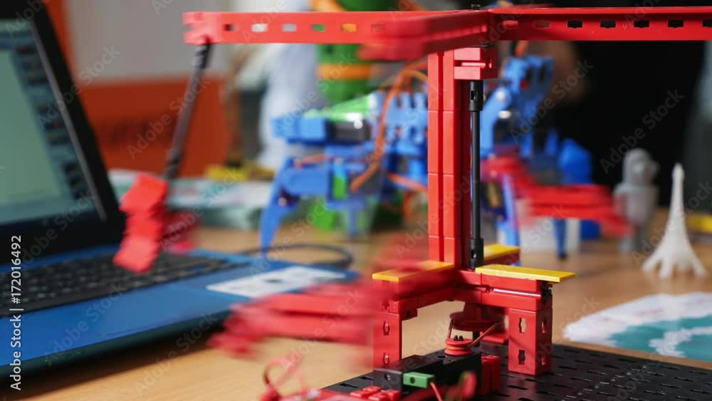 Automatic robotics simulator model with computer based control is shown ...