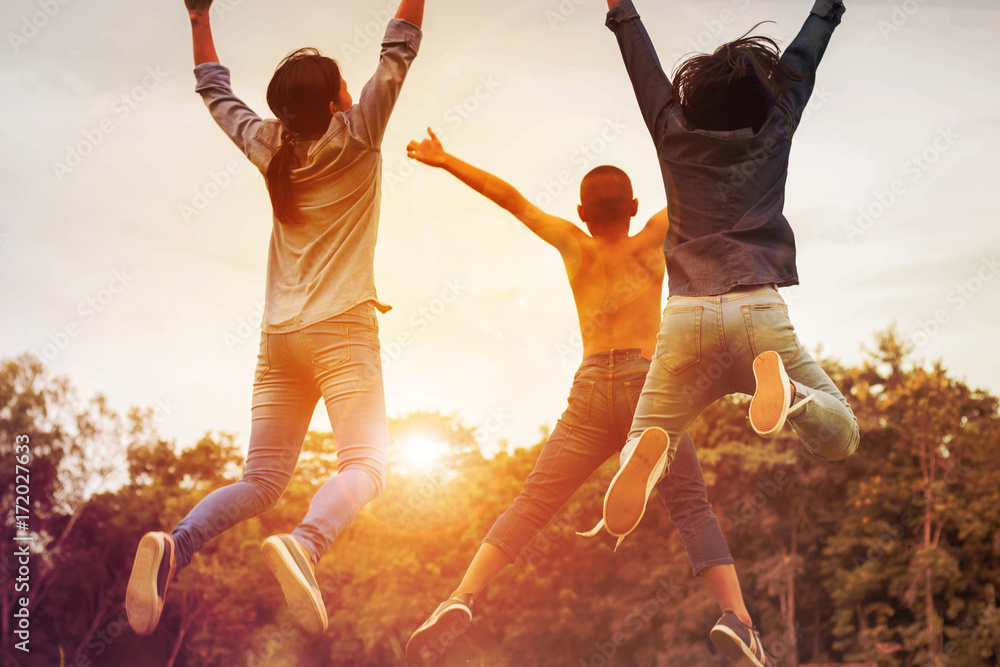 people jumping with happy, a boy ,a girl and a woman jumping with ...