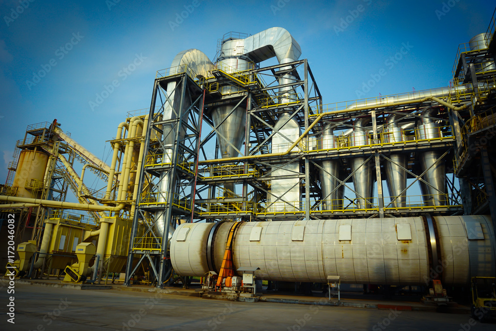 Factory view of particle board products: sky, conveyor, drum dryer ...