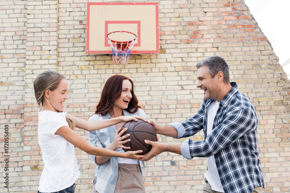 family playing basketball Stock Photo | Adobe Stock