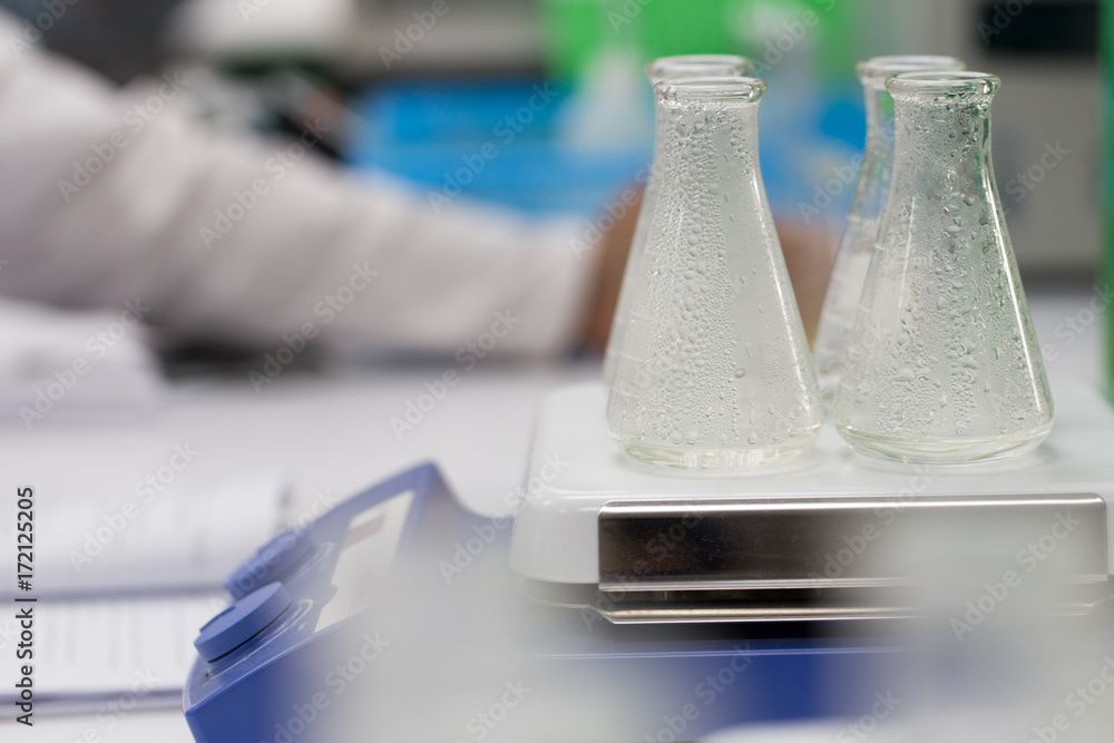 Experiment chemical solution mixing liquids on a Hotplate Stirrer in ...