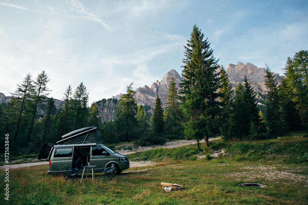 Small travel vehicle camping van or big car with folding rooftop with ...