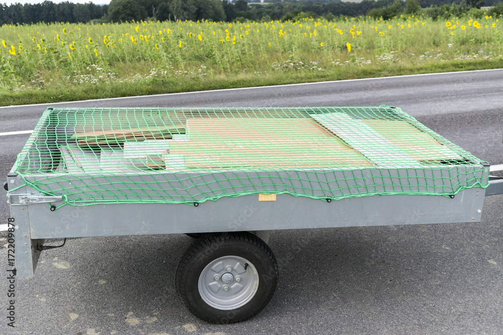 trailer with net for load securing Stock-Foto | Adobe Stock