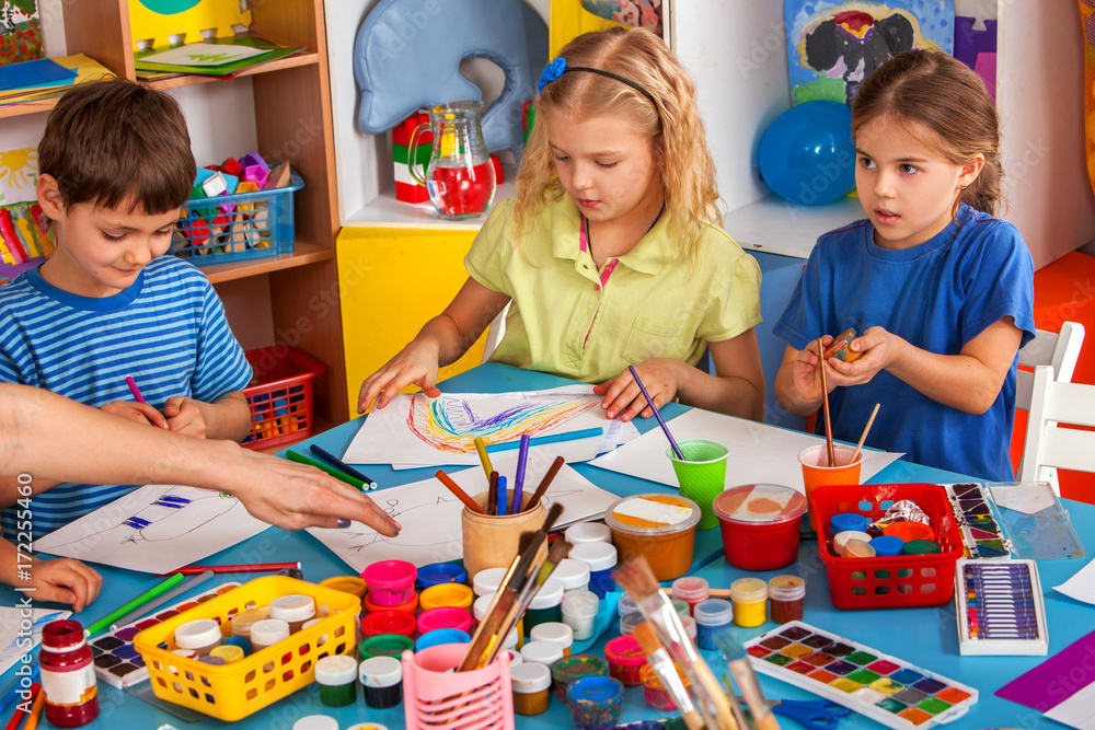Small students painting in art school class. Children boy and girl ...
