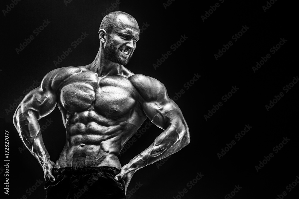 Strong bald bodybuilder with six pack. Strong bodybuilder man with ...