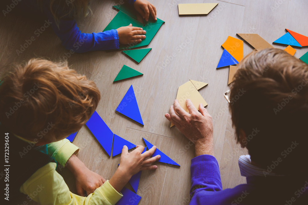 teacher and kids playing with geometric shapes Stock Photo | Adobe Stock
