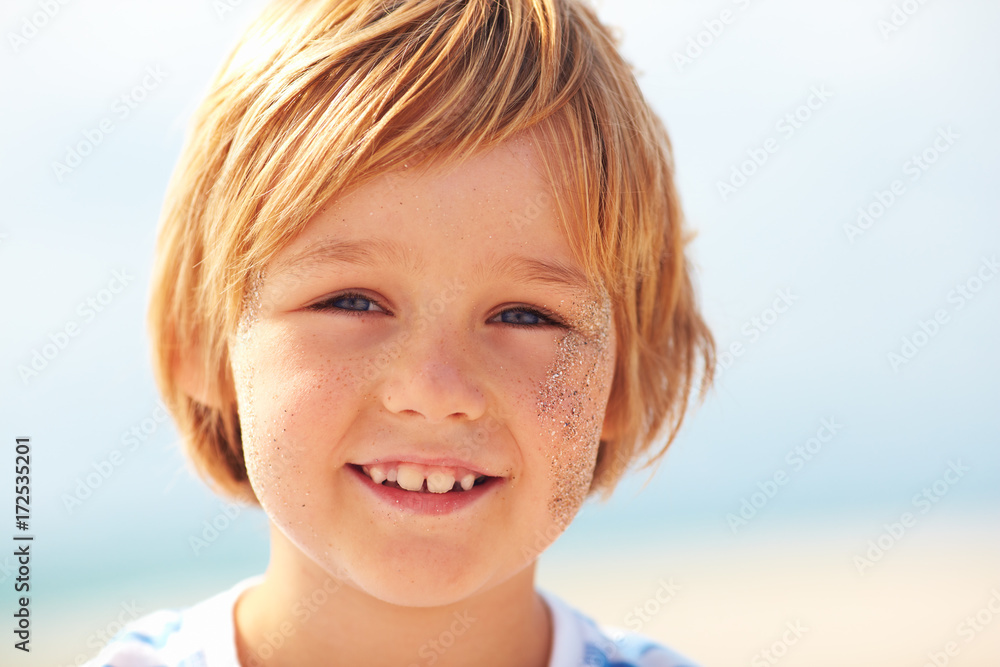summer portrait of handsome boy face with freckles and sand on sunny ...