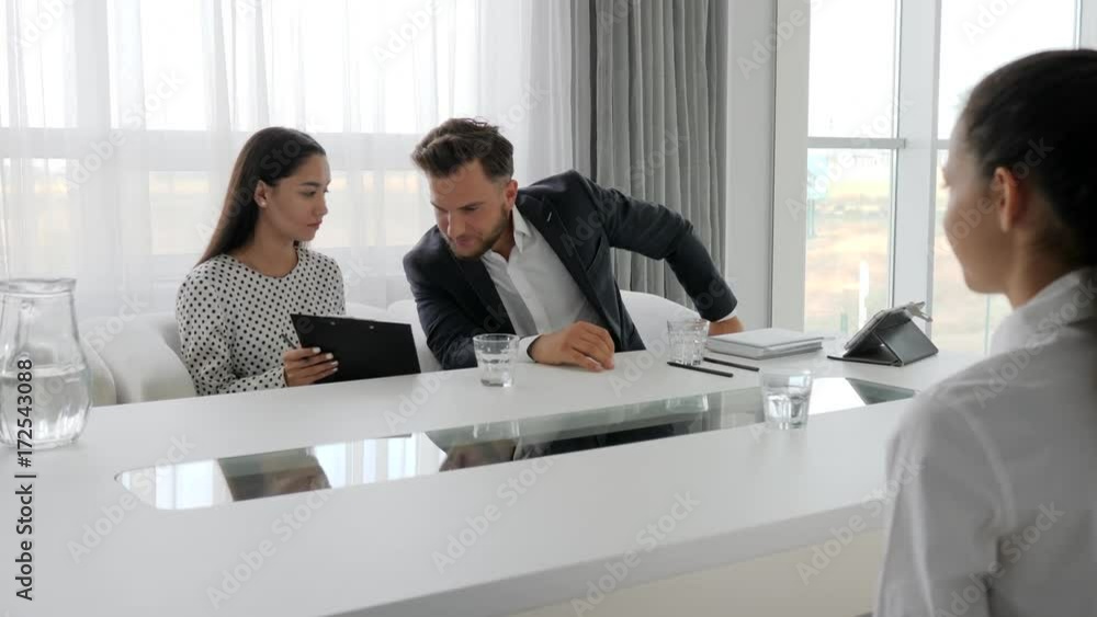 holding meeting, people at table in business center, secretary and boss ...