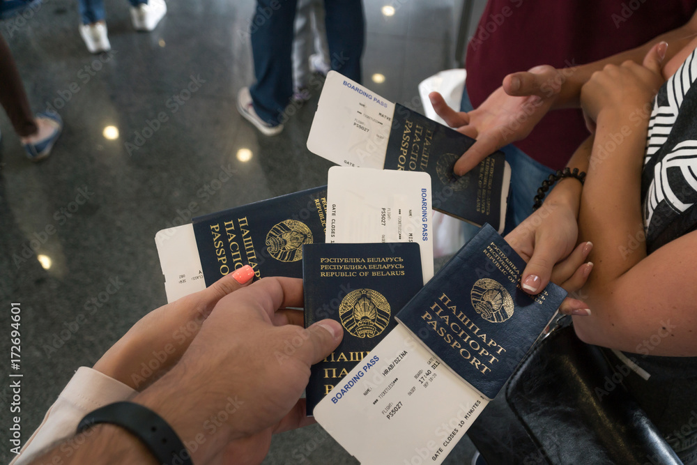 Group of Diverse Friendship Hands Show Passport with Plane Ticket Stock ...