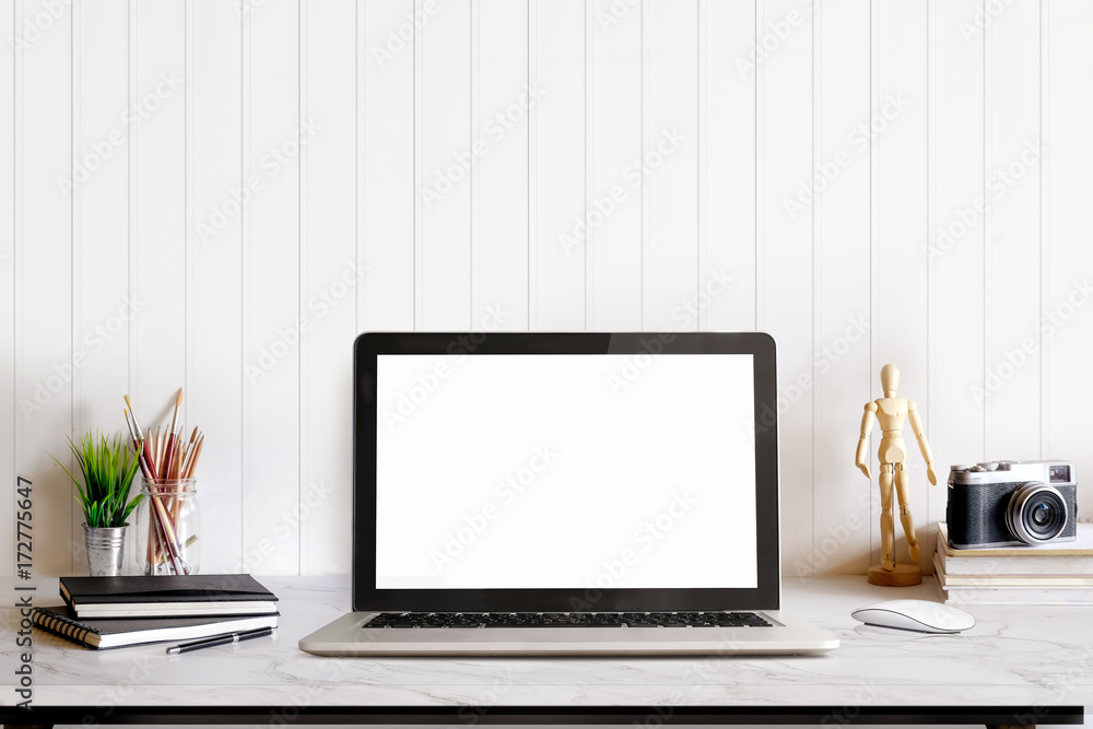 Stylish workspace with laptop computer, office supplies houseplant ...