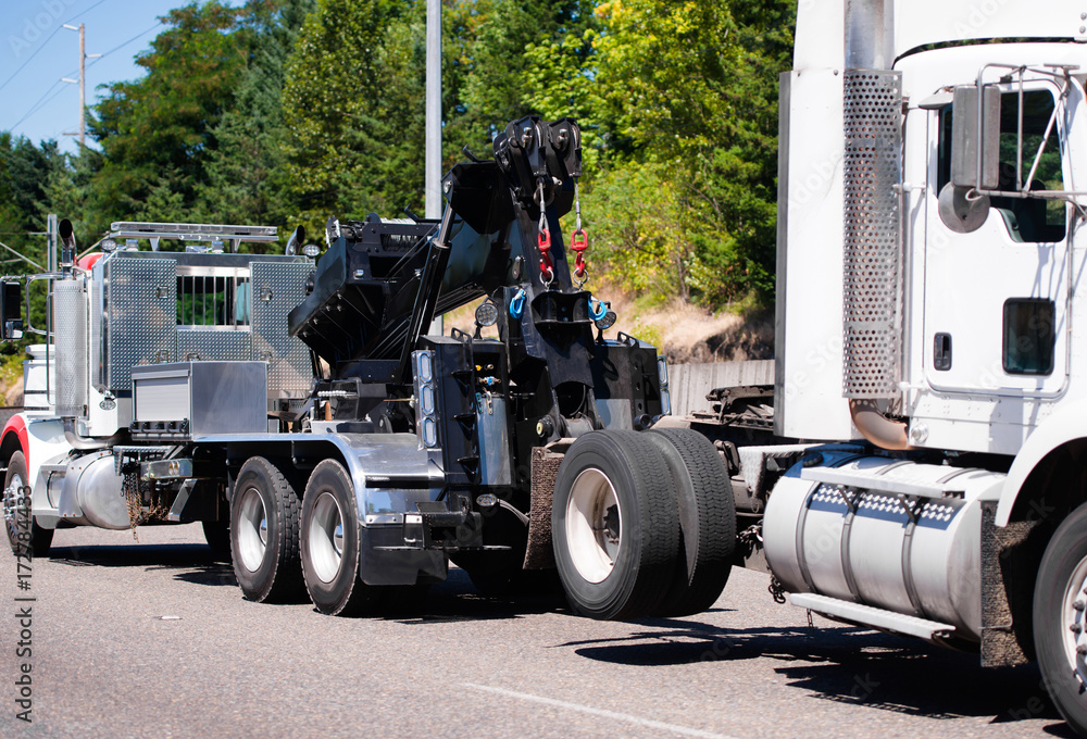 Big rig towing semi truck tow ather semi truck tractor on the road ...